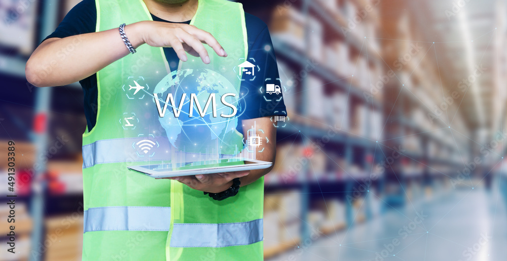 WMS,Smart warehouse management system.Worker hands holding tablet on ...