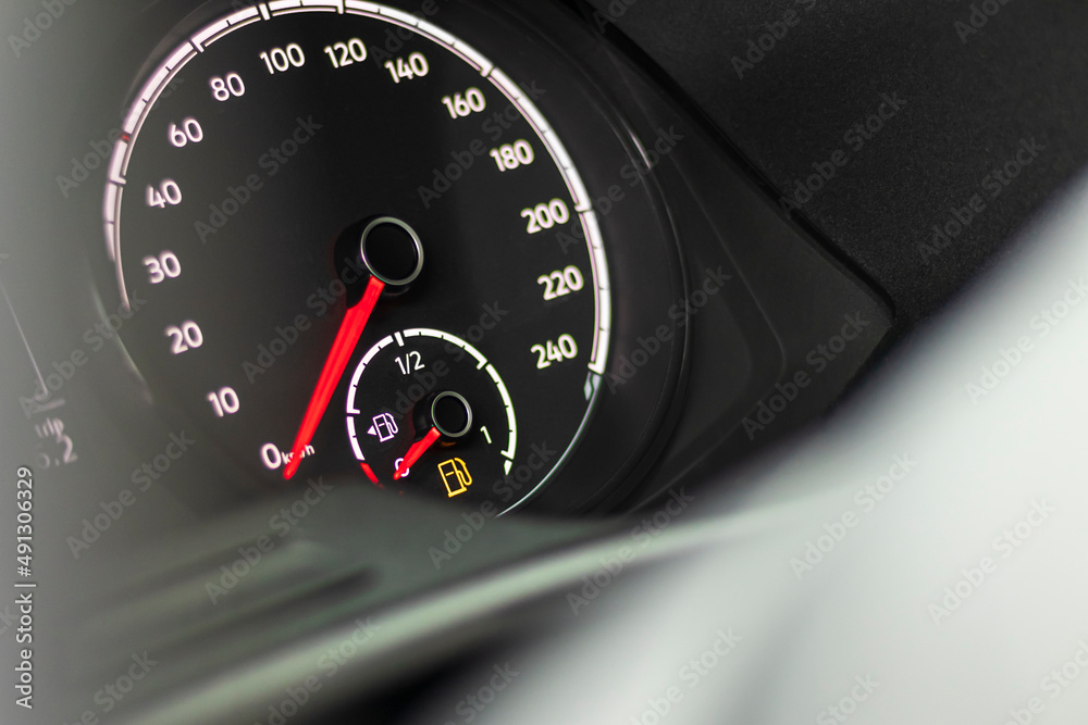 Fuel discharge warning light on the dashboard of the car. The low fuel ...