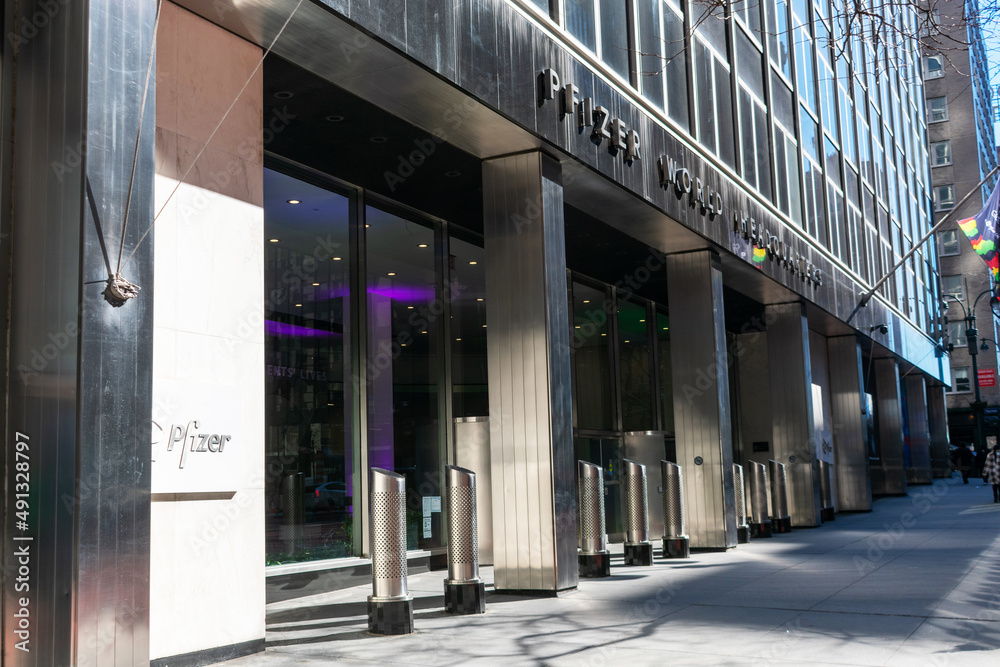 Pfizer sign, logo on the facade of pharmaceutical and biotechnology ...