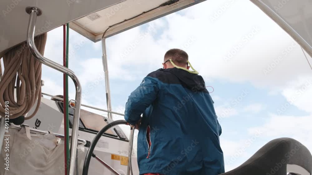 Vídeo do Stock: boat captain active confidently steering sail on his ...