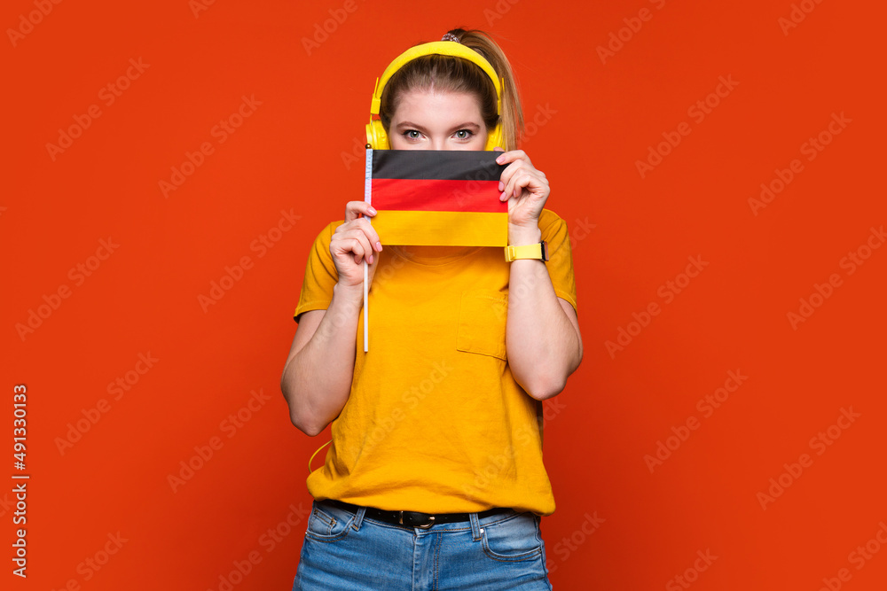 Learning German, student exchange and travel. Happy lady holding small ...