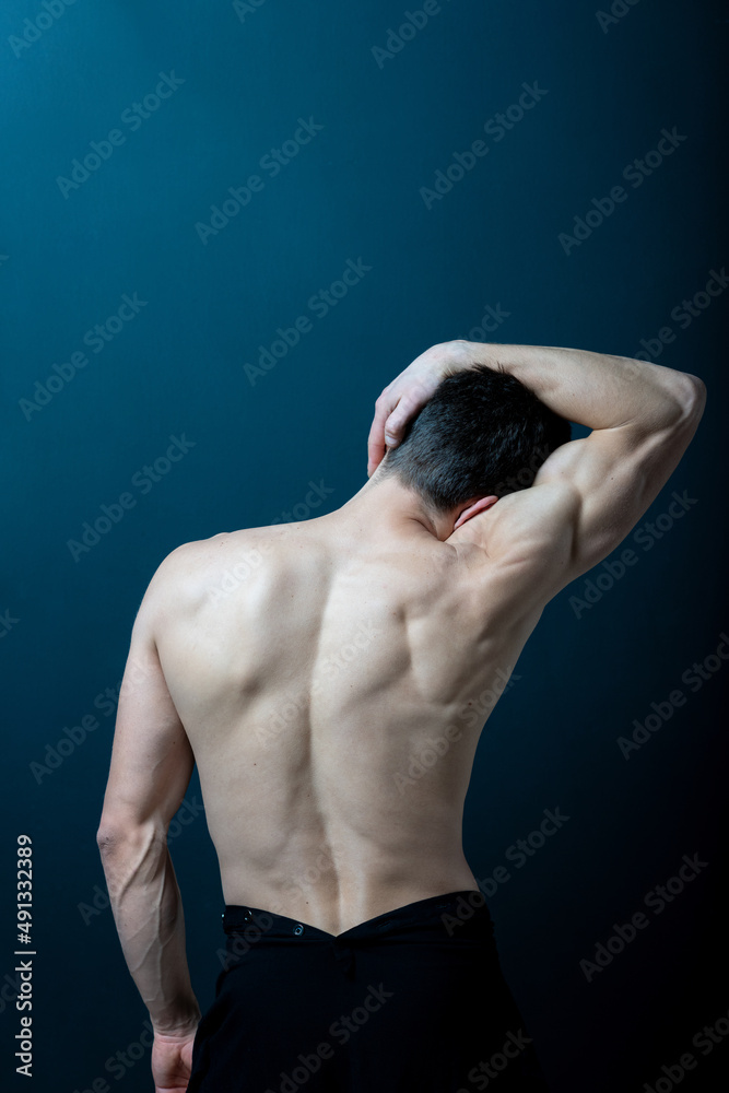 Back view of faceless muscular shirtless acrobat male. Stock Photo ...