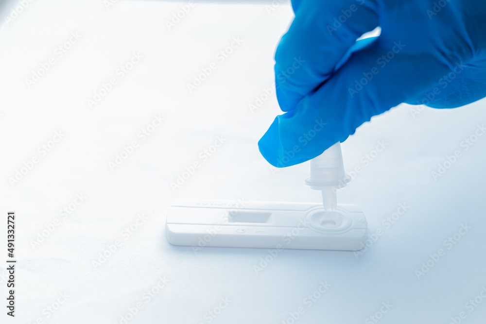 Scientist making a antigen rapid test kit for viral disease COVID-19 ...