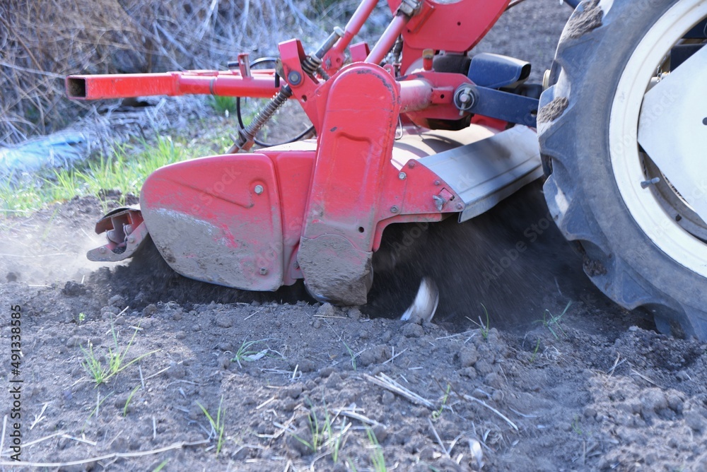 A farming scene where a field is cultivated with a tractor. Stock Photo ...