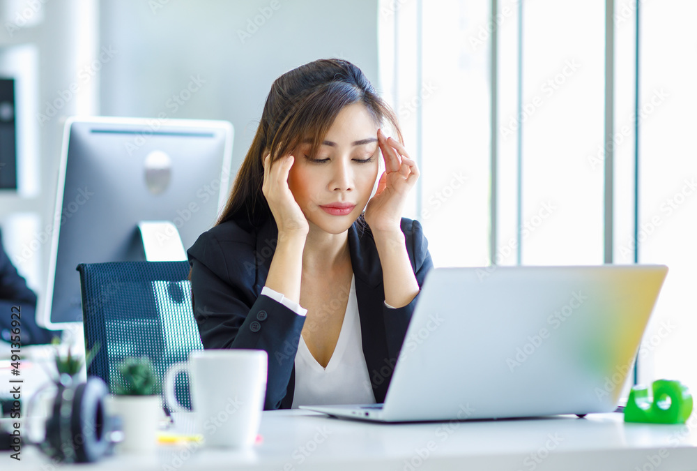 Asian young stressed depressed tired exhausted female businesswoman ...