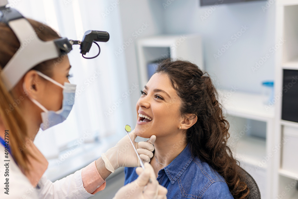 Female Patient Opening Her Mouth For The Doctor To Look In Her Throat Female Doctor Examining