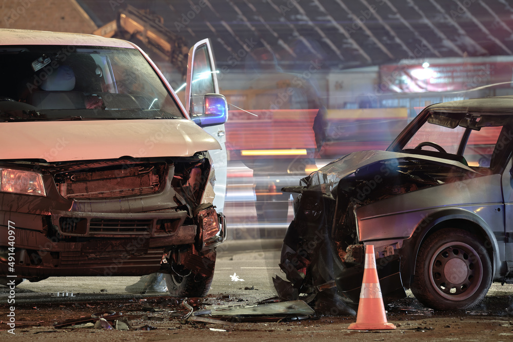 Damaged in heavy car accident vehicles after collision on city street ...