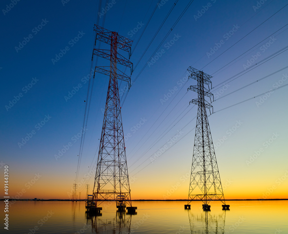 High voltage transmission lines crossing Wheeler Lake at dusk near ...