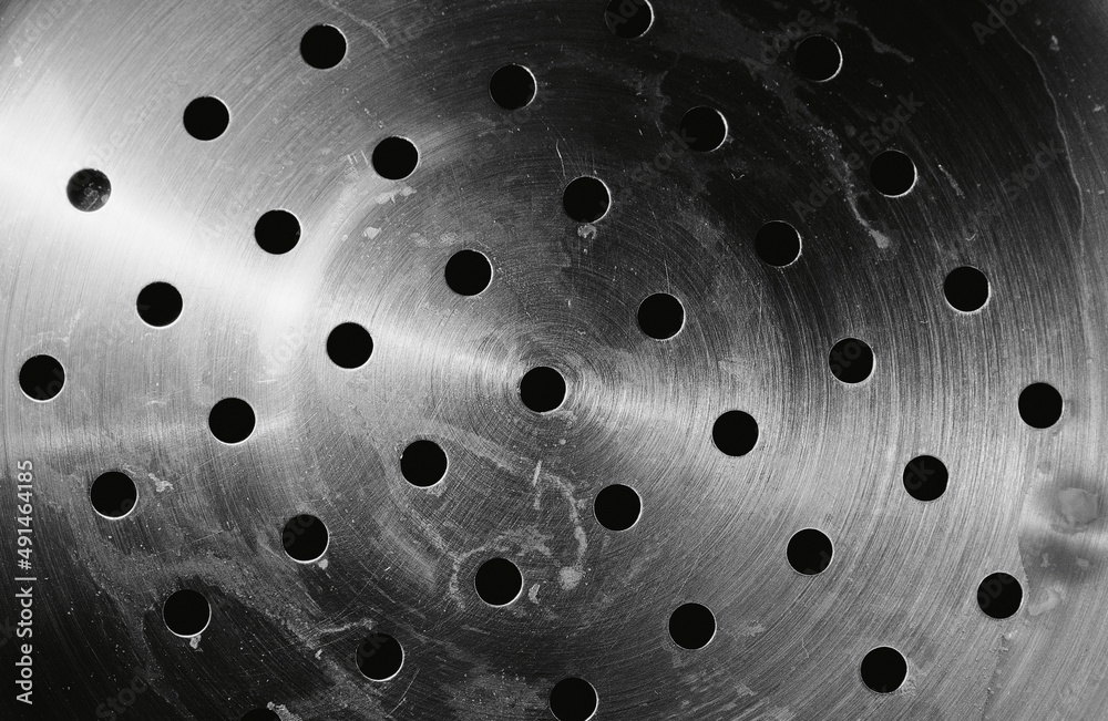 Holes in metal background Stock Photo | Adobe Stock