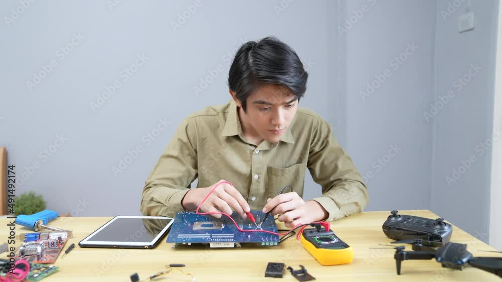 technology concept of 4k Resolution. Asian man checking the electrical ...