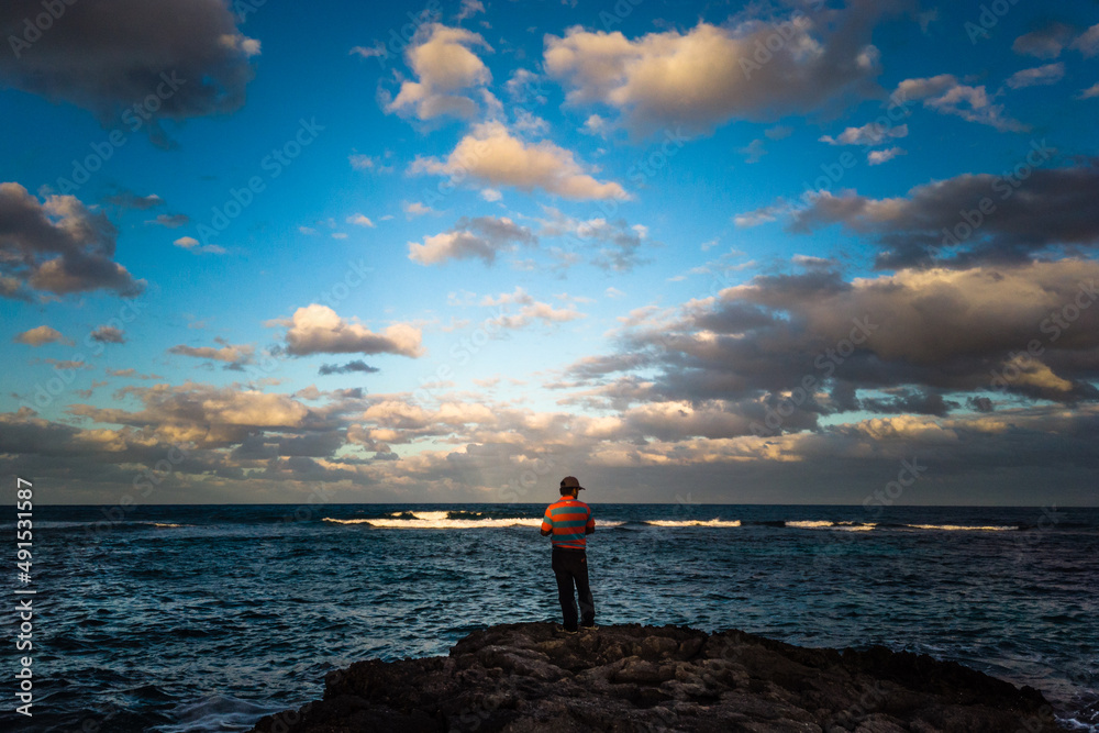 person watching the sea Stock Photo | Adobe Stock