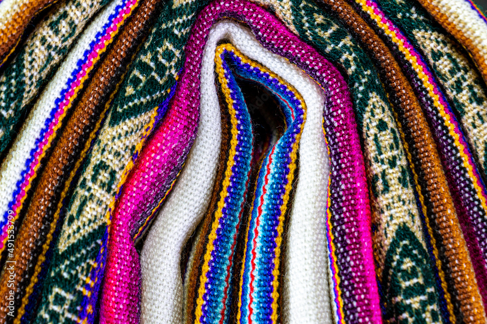 Lliclla - traditional woven blanket worn by women in the Peruvian Andes ...