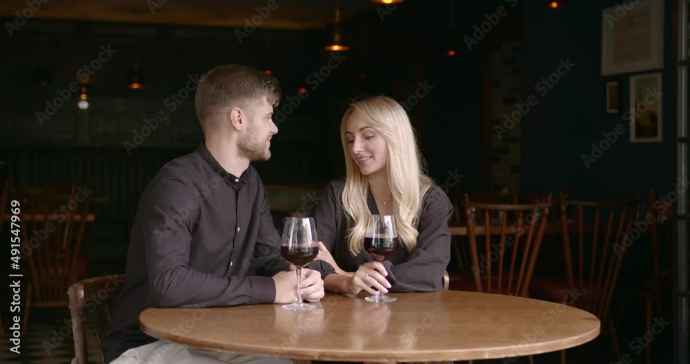 Man and woman having a date in a restaurant Stock Video | Adobe Stock