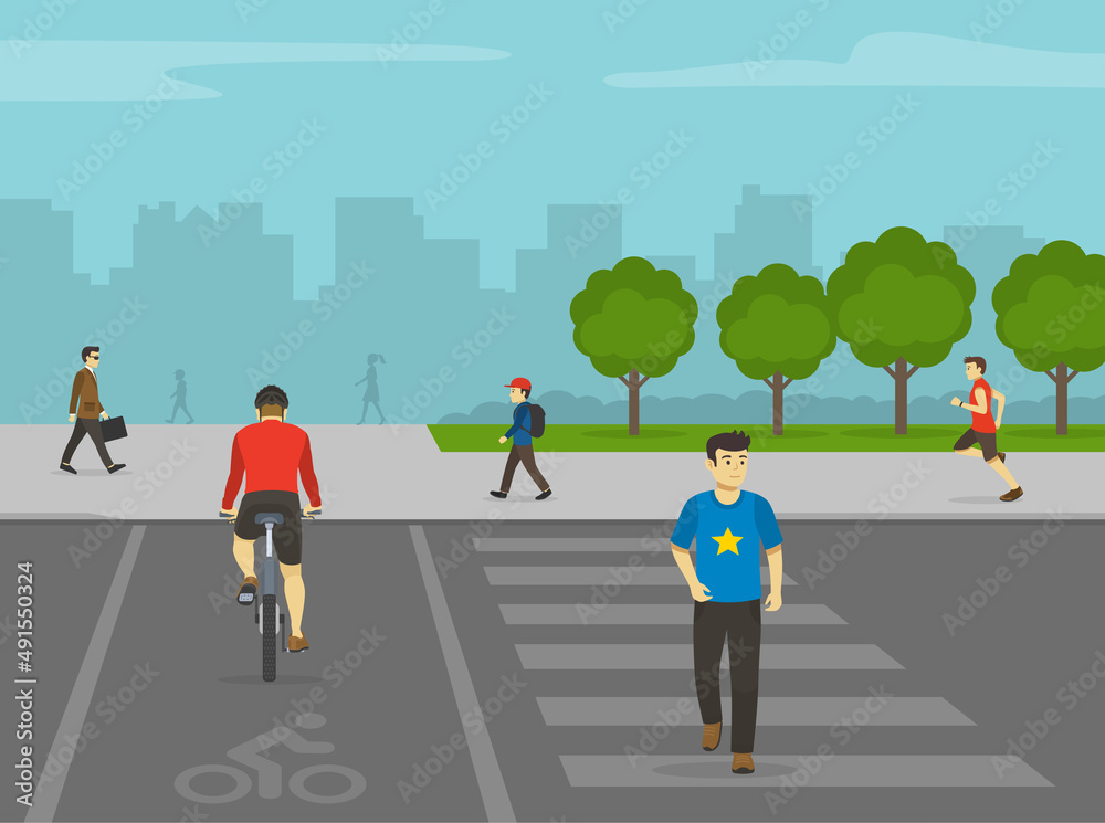 Pedestrian and cyclist crossing the shared road on pedestrian crossing ...