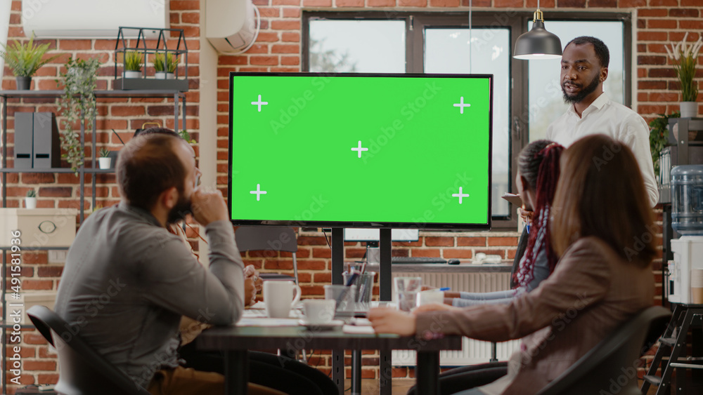 People talking and using isolated green screen on display in office ...