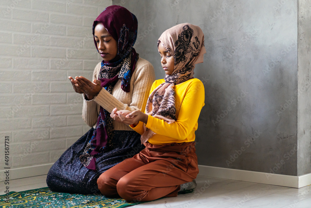 Praying and teaching, child and adult praying together Stock Photo ...