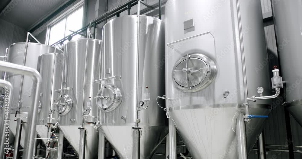 Modern tank for mashing malt for brewing beer in brewery plant. Brewing ...