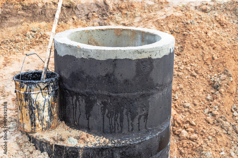 Installation of a reinforced concrete well for water supply and ...