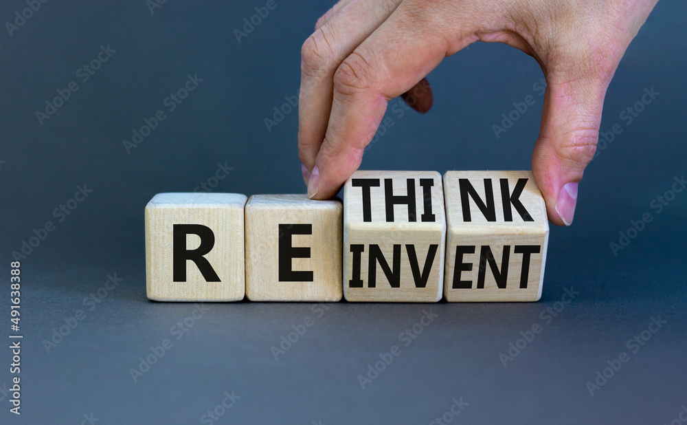 Reinvent and rethink symbol. Businessman turns cubes and changes the ...