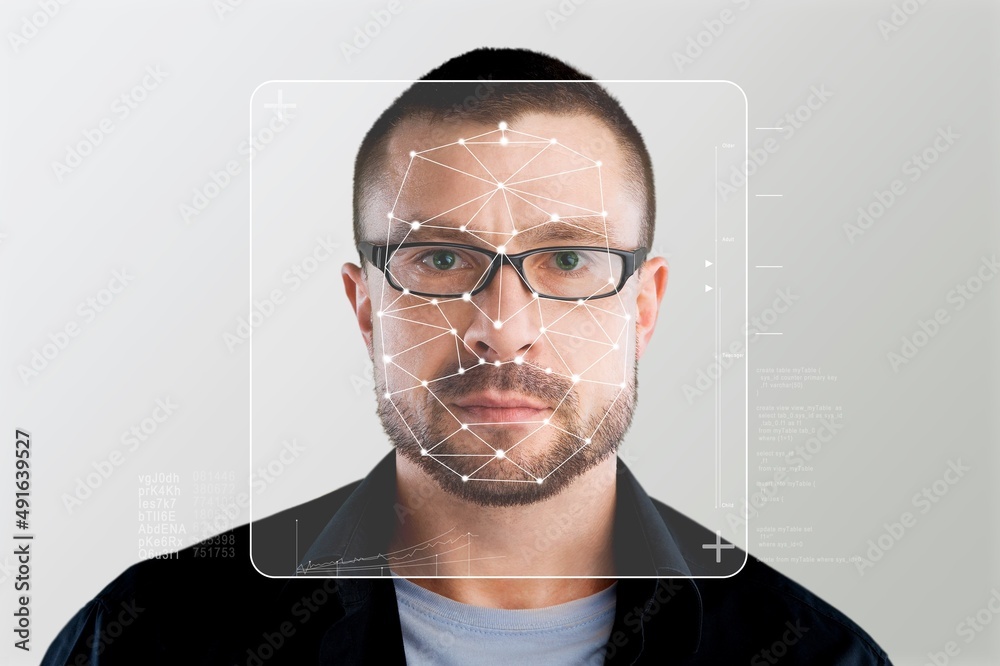 Serious business person and smart technology for face recognition ...