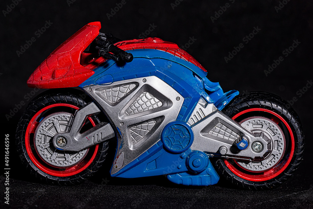 Spiderman motorcycle toy. Stock Photo | Adobe Stock