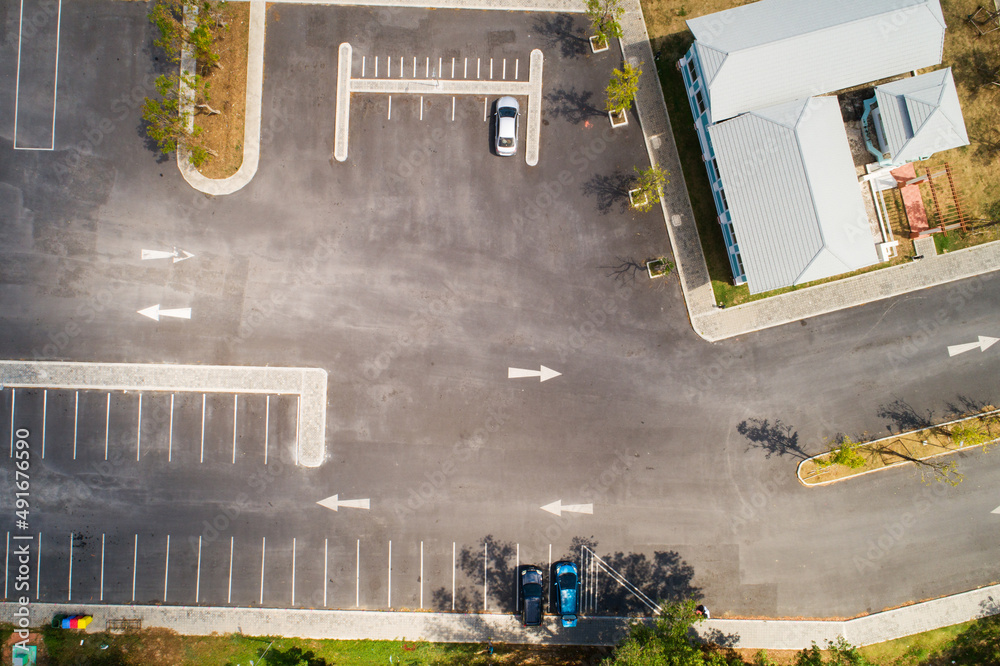 Aerial view top down of car parking lot with white line of traffic sign ...