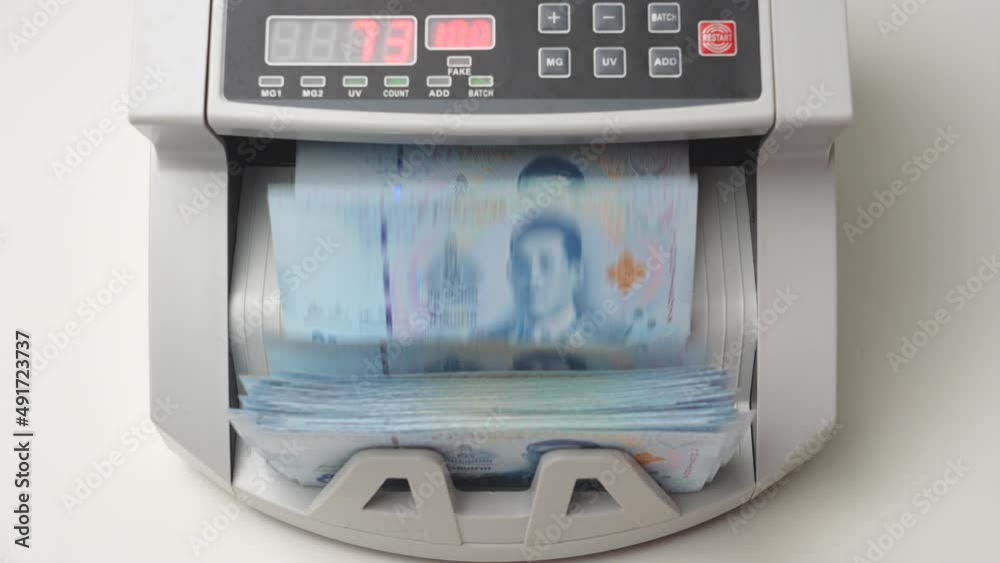Thai Baht money counting in Machine. Paper THB Thai baht banknotes ...
