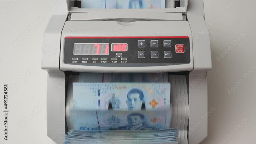 Thai Baht money counting in Machine. Paper THB Thai baht banknotes ...