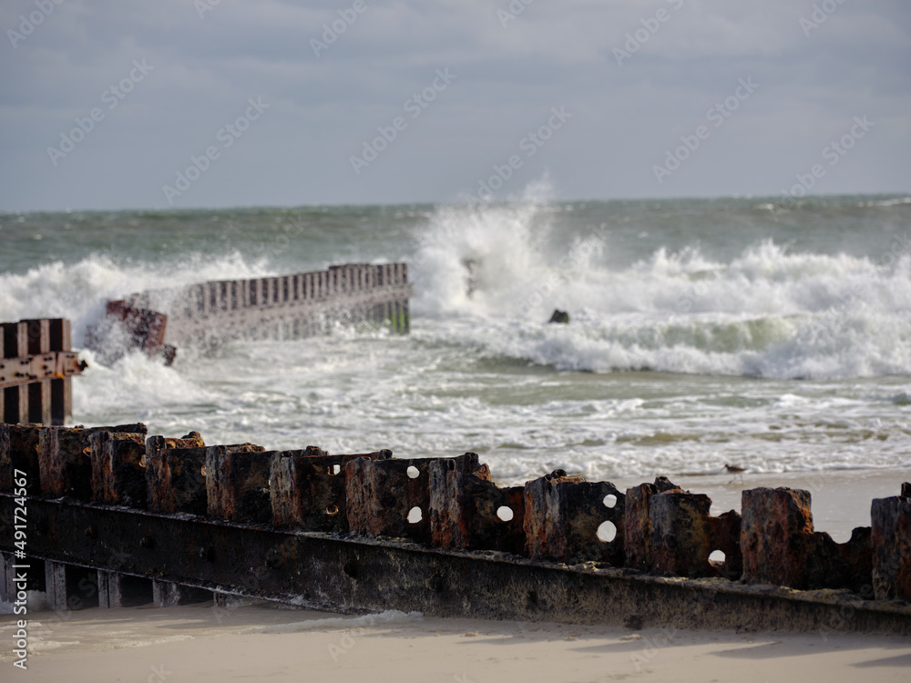 Heavy surf pounds the old sea wall where the old Cape Hatteras ...