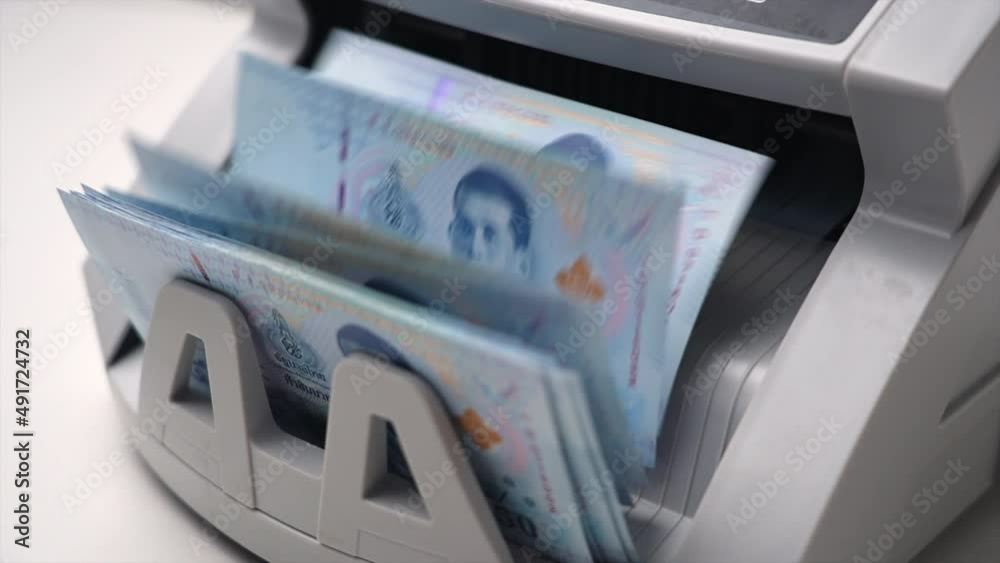 Thai Baht money counting in Machine. Paper THB Thai baht banknotes ...