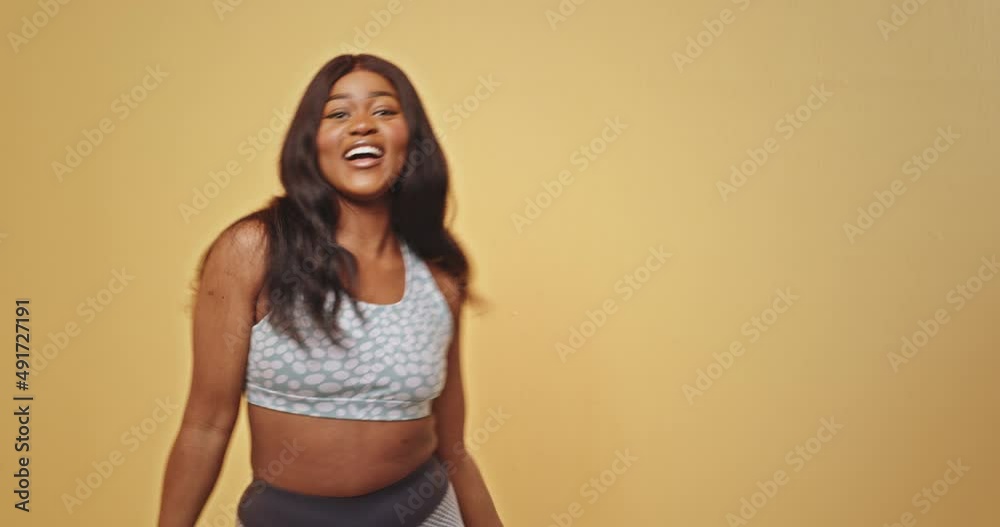 African woman jumping while performing modern dance. Beautiful woman ...