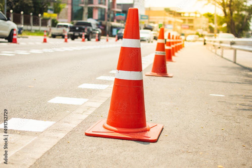 Traffic cones are placed on the road. Stock Photo | Adobe Stock