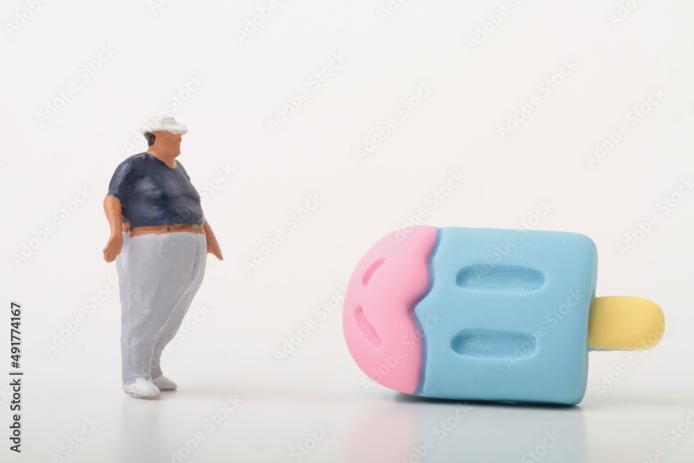 miniature figurine of a fat man with a giant ice cream Stock Photo ...