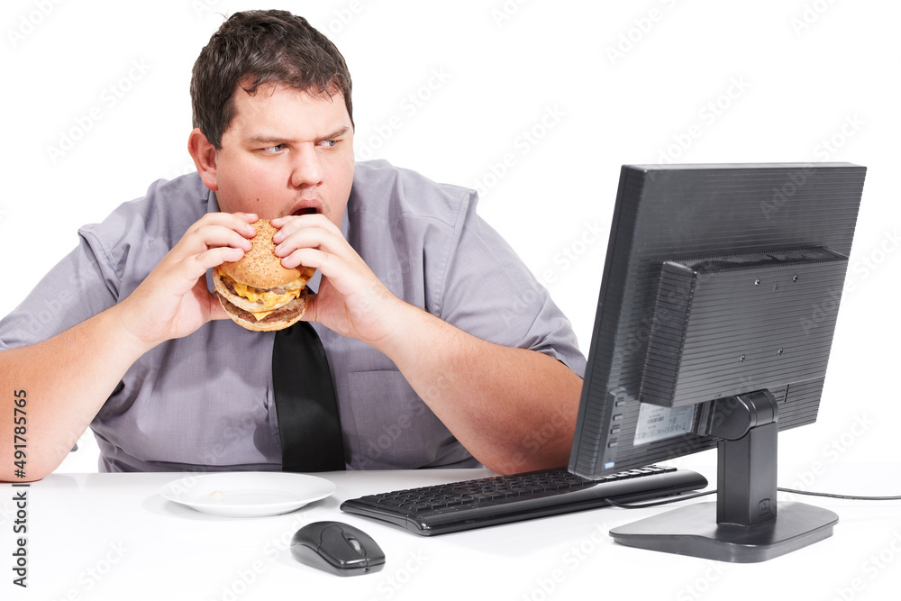 Stop showing me healthy things. A young man eating his lunch at his ...