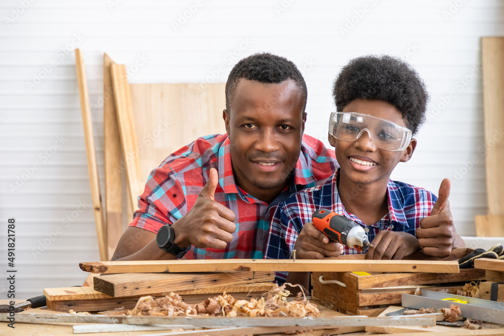 African black male carpenter man father teach boy kid child son to be ...