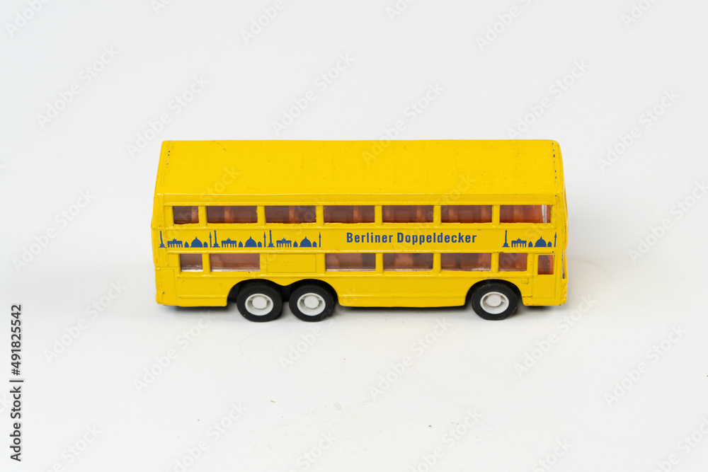 Yellow double decker metal bus, big tourist bus mini toy, isolated on ...