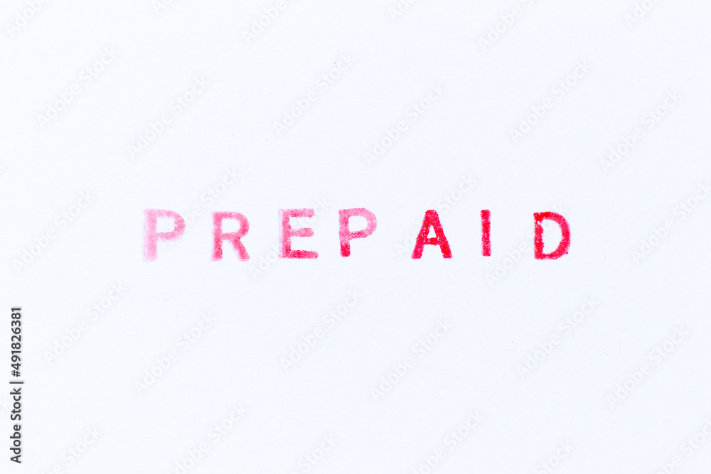 Red color ink rubber stamp in word prepaid on white paper background ...