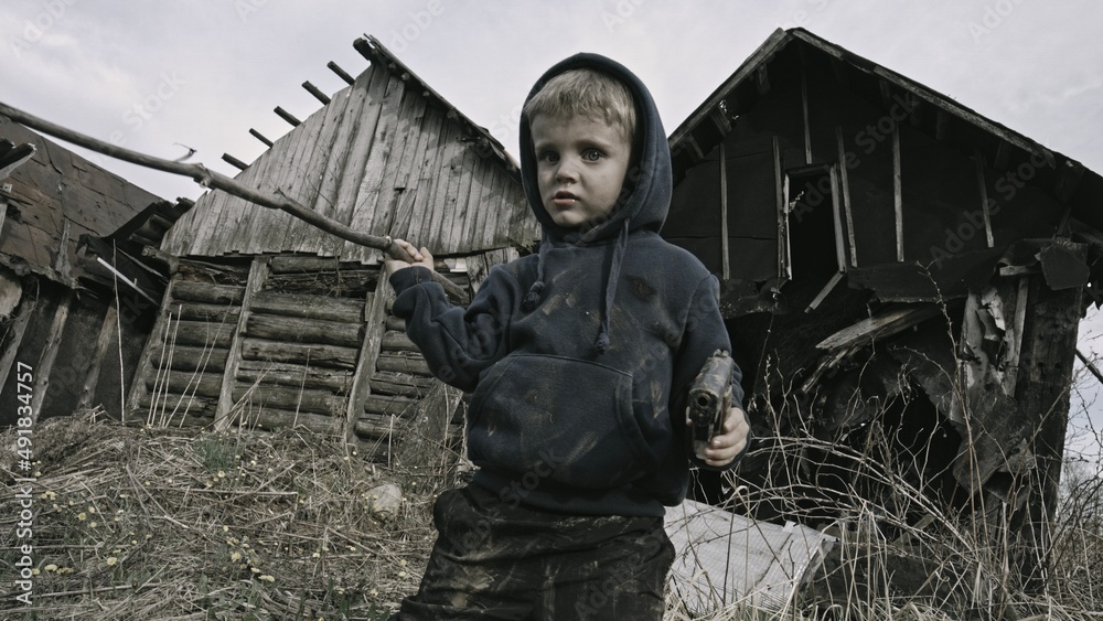 Child playing war in ruins Stock Photo | Adobe Stock