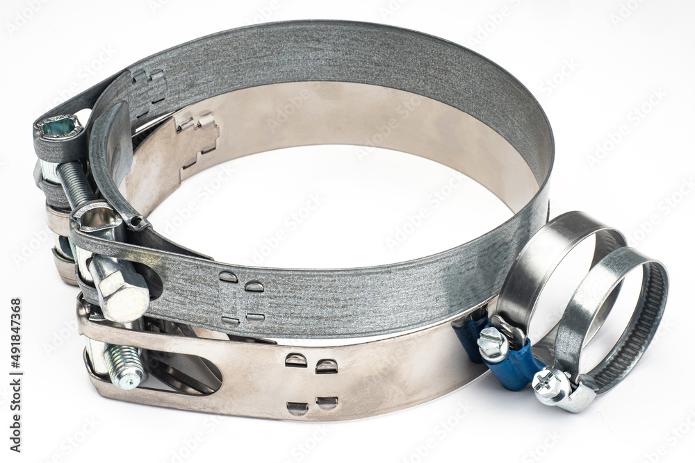 Clamps of different sizes close-up. Industrial steel clamps. Metal ...