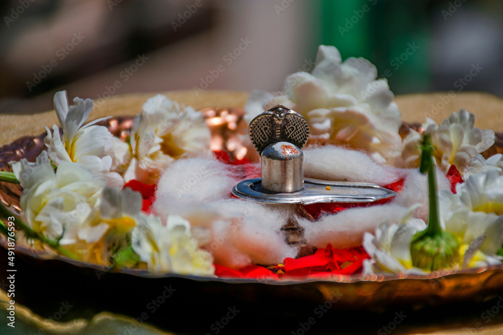 Stock photo of a silver shivlinga which is icon of lord shiva snake ...