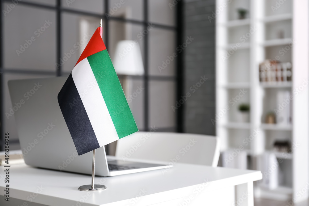 UAE flag on table in modern office, closeup Stock Photo | Adobe Stock