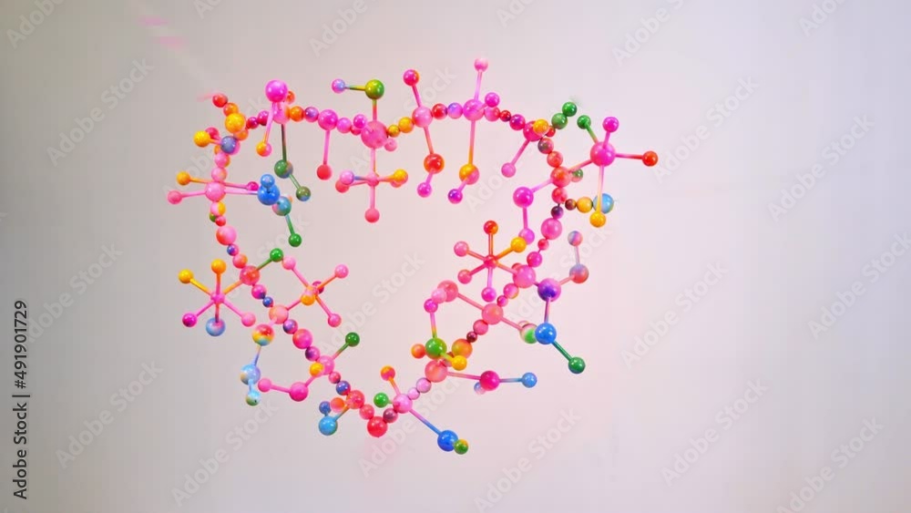 Colorful spheres balls like atoms..colors from atom of heart shape are ...