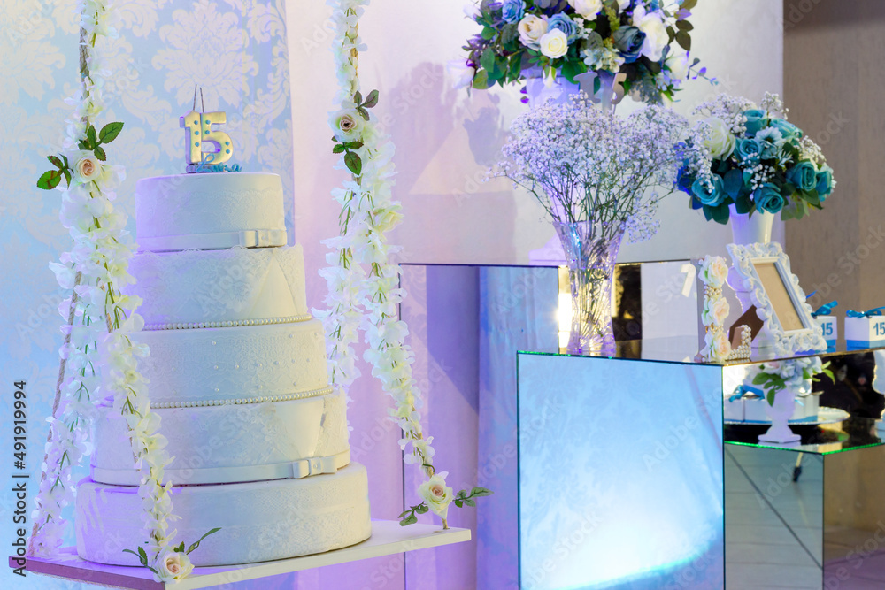 15th birthday party. Debutant party. Table with flowers and number 15 ...