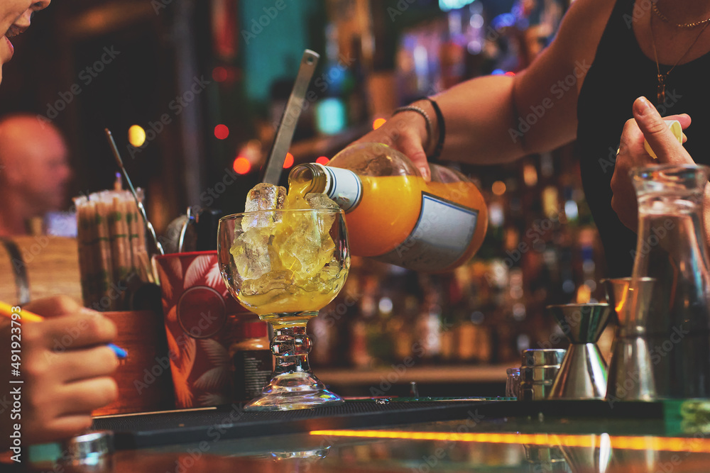 Female barman preparing drinks. cocktail bar Drinks at the bar. Fresh ...