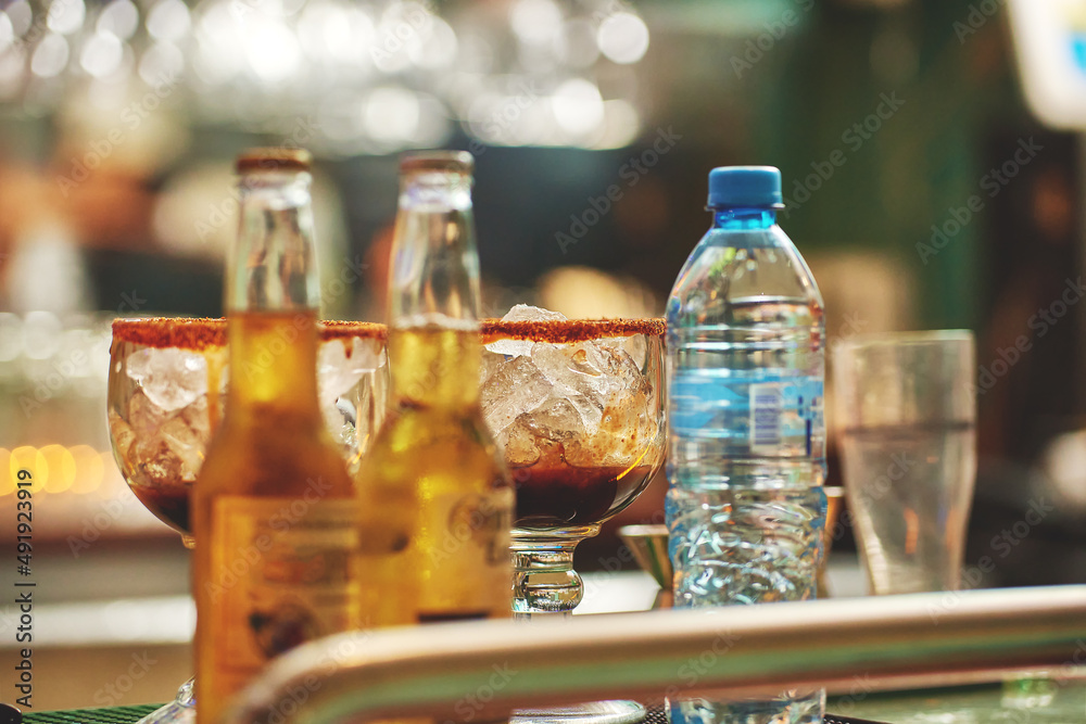 Female barman preparing drinks. cocktail bar Drinks at the bar. Fresh ...