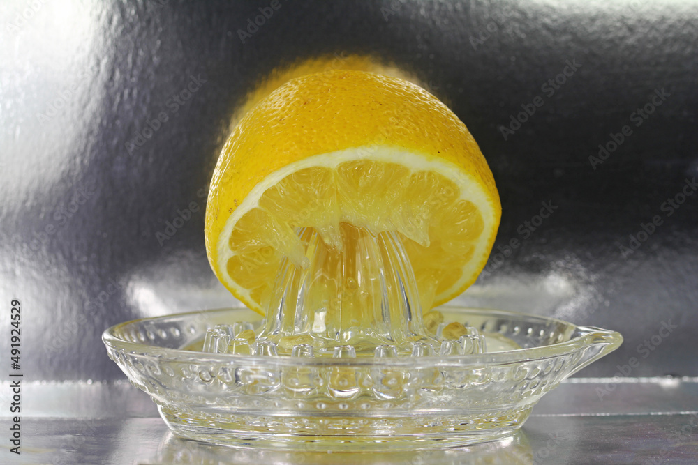 Lemon with press from glass squeeze Stock Photo | Adobe Stock