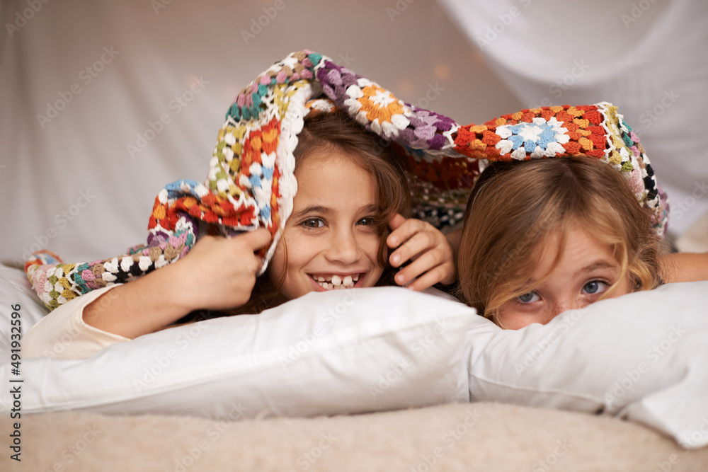 Sleepover fun. Shot of two cute little girls having a sleepover. Stock ...