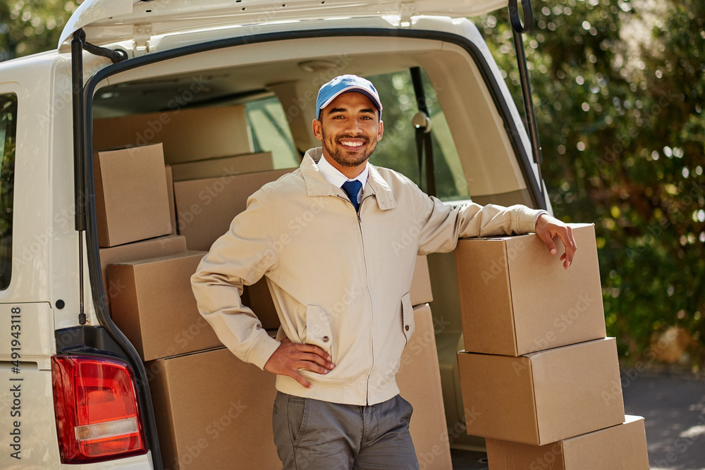 Striving for service excellence. Portrait of a friendly delivery man ...