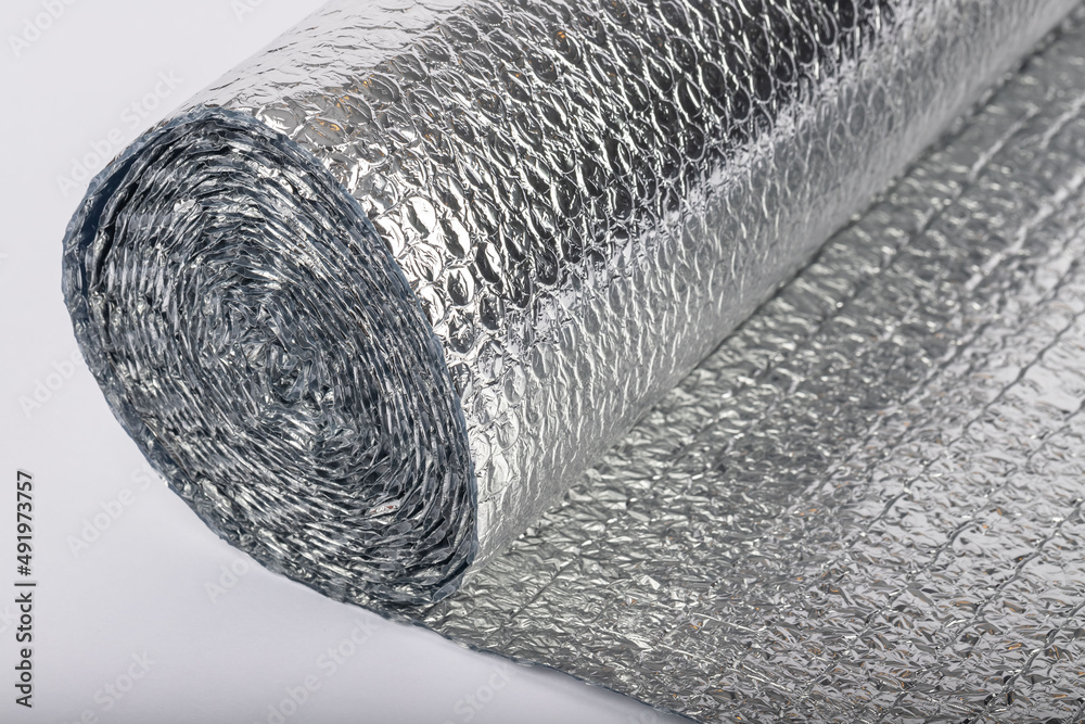 silver thermal insulation material stands on a white background. Stock ...