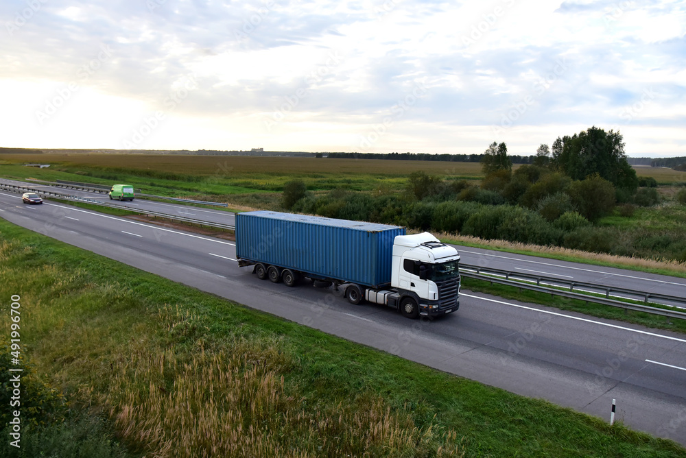 Semi Truck transport the Shipping container on highway. Shipping ...
